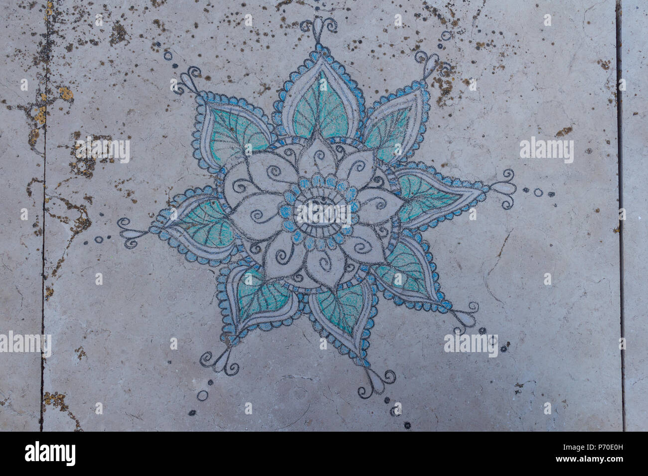 Chalk painting of a mandala on the marble on the street Stock Photo - Alamy