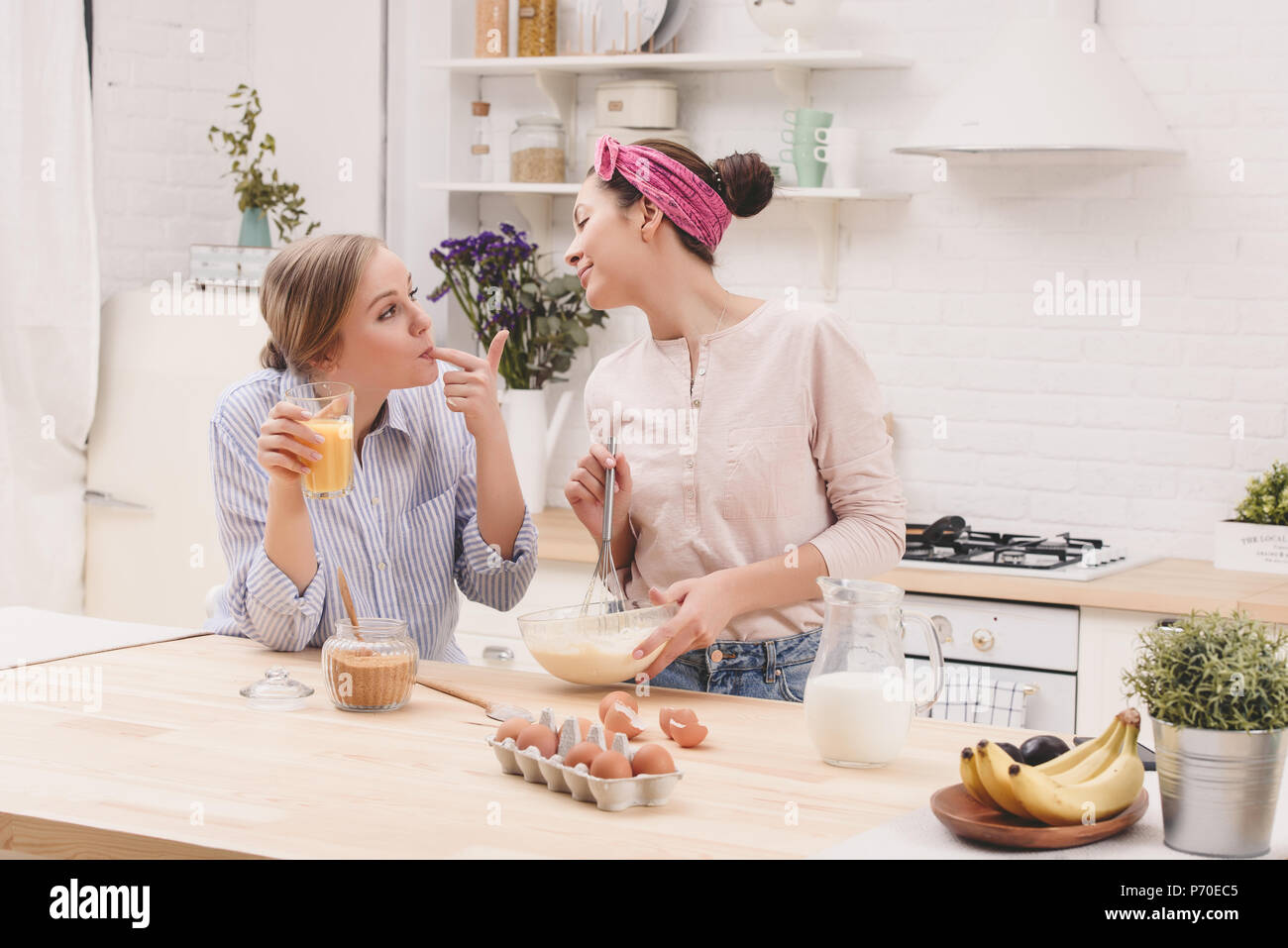 Two cheerful friends cook together. Friends Chef Cook Cooking Concept ...