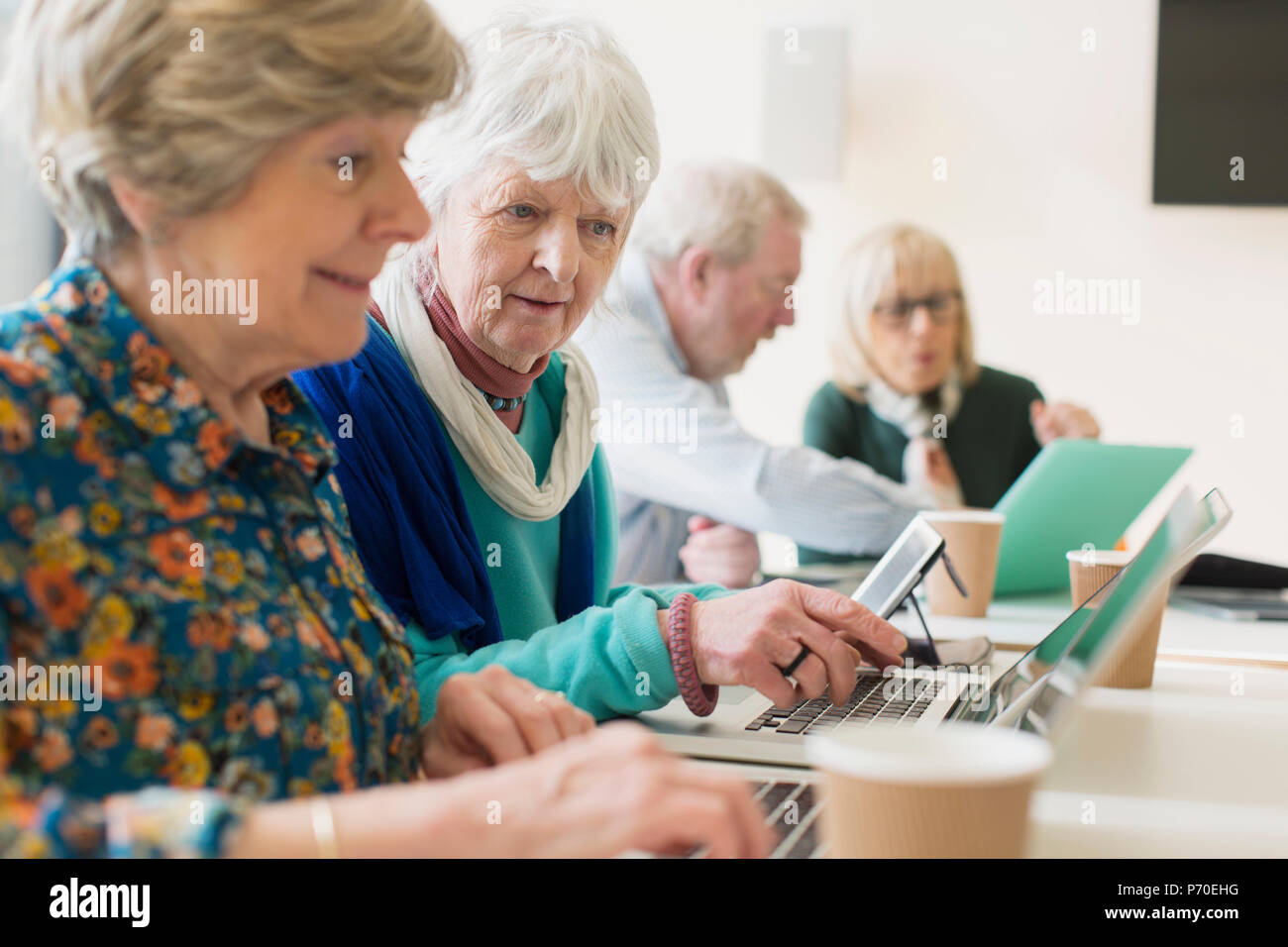 Women using laptops hi-res stock photography and images - Alamy