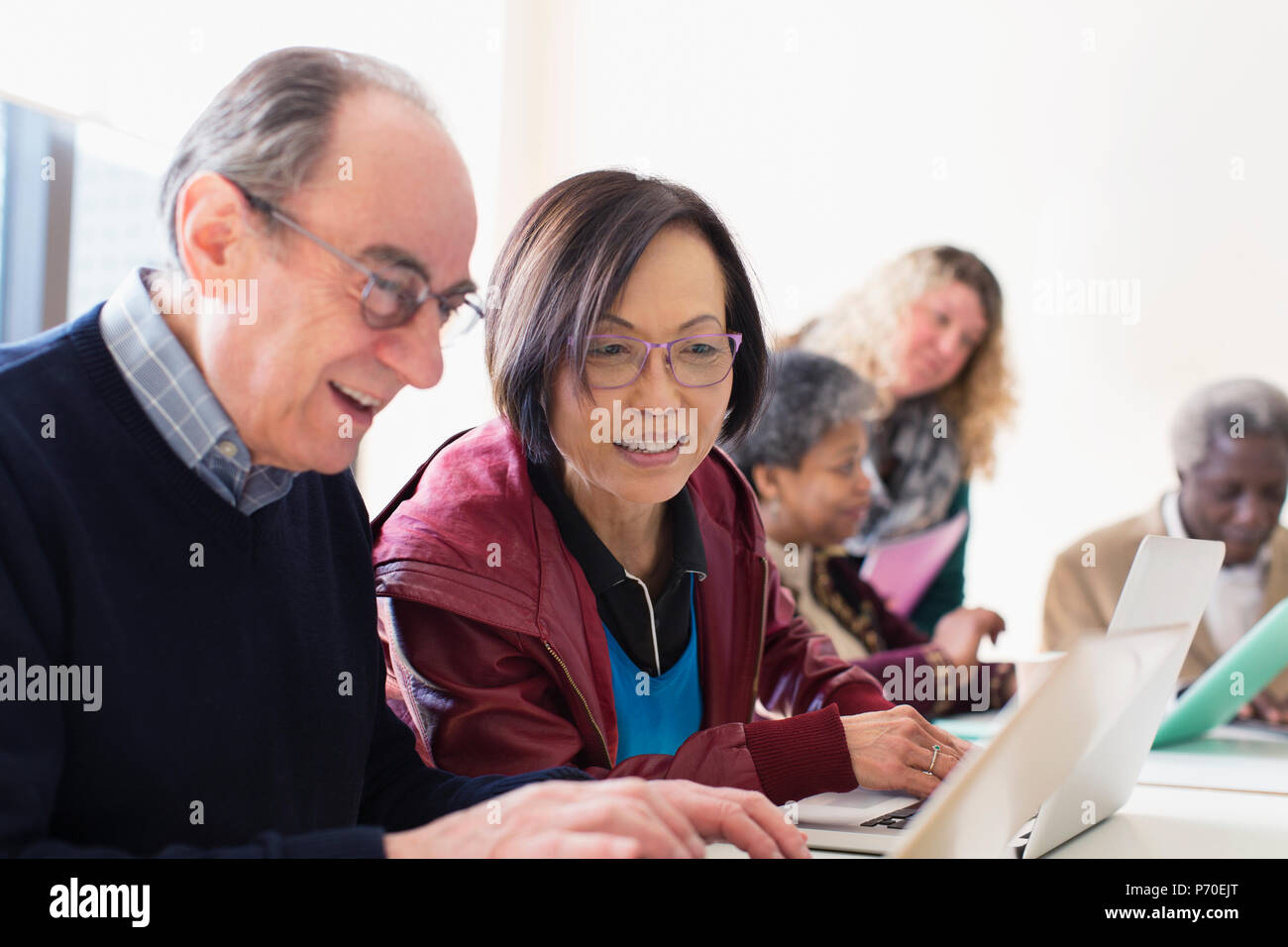 Senior business people using laptop in conference room meeting Stock ...