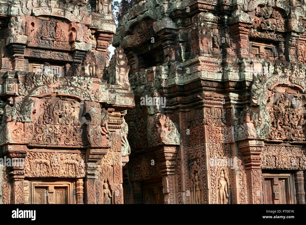 Beautifully carved pink stone temple walls in Banteay Srei Temple in ...