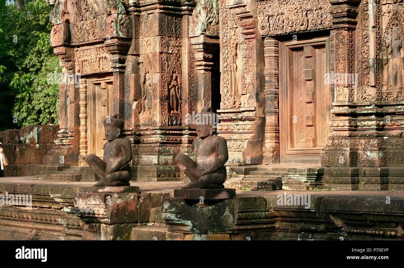 Beautifully carved pink stone temple walls in Banteay Srei Temple in ...