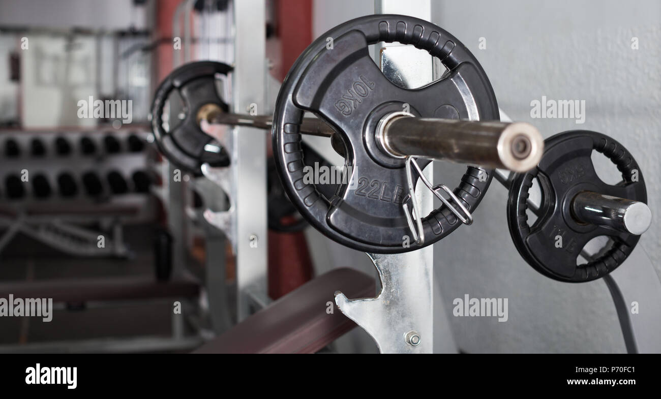 Closeup of weightlifting gear in modern gym interior Stock Photo - Alamy
