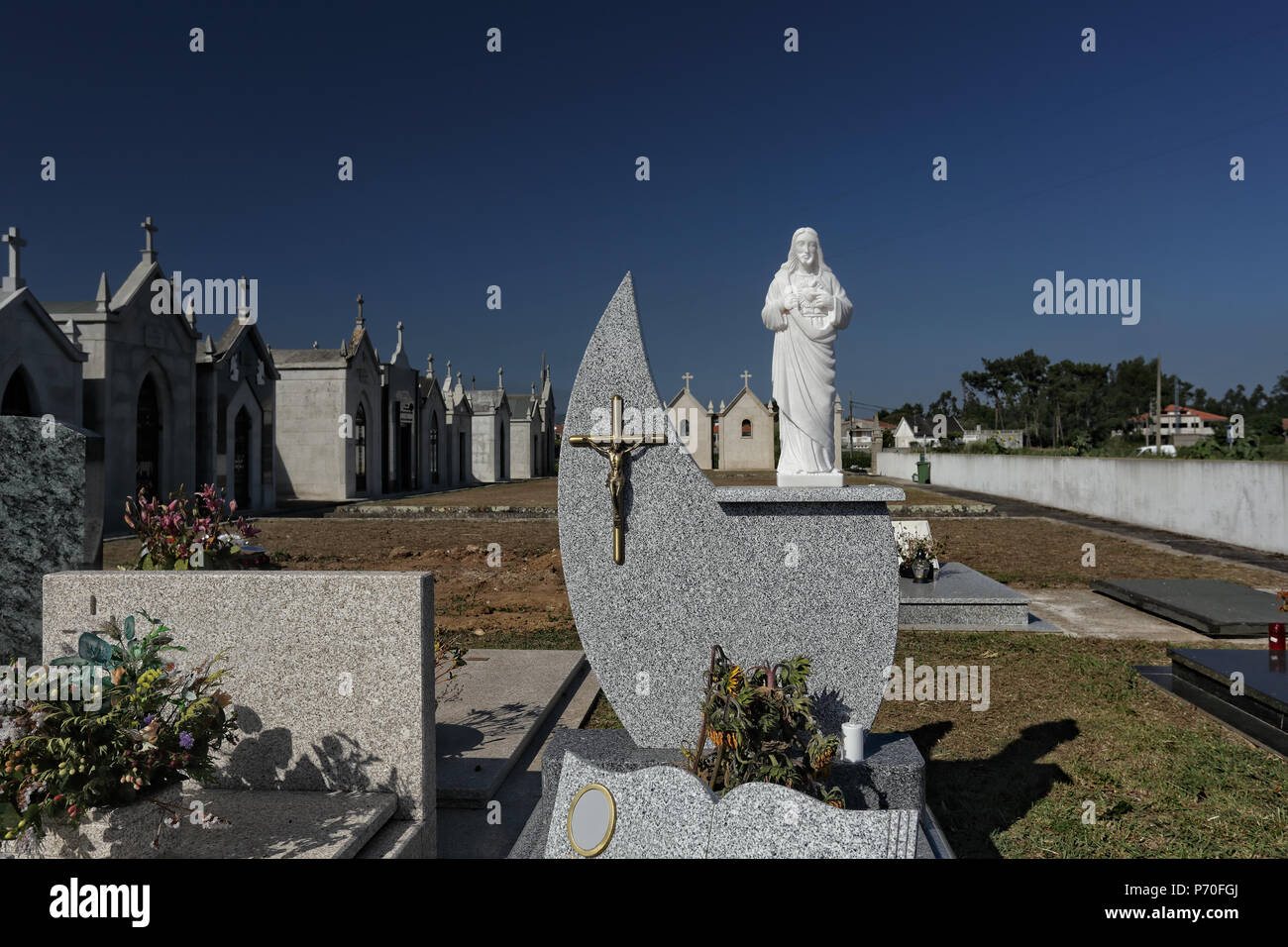 European cemetery with granite graves, crucifix, christ and chapels ...