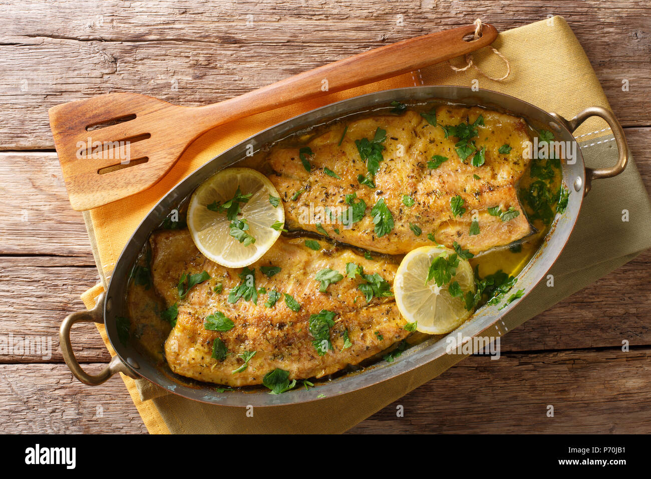 Delicious fish: baked trout fillets with garlic buttery herb sauce ...