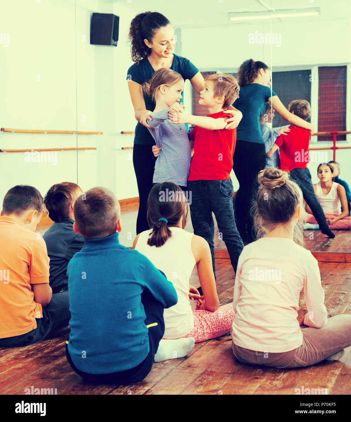 Friendly children studying of partner dance at dance school Stock Photo ...
