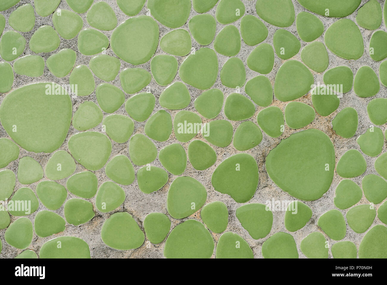 full frame image of decorated green stone wall background Stock Photo ...