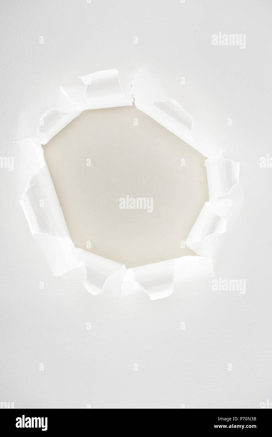 White ripped paper with copy space in center Stock Photo - Alamy
