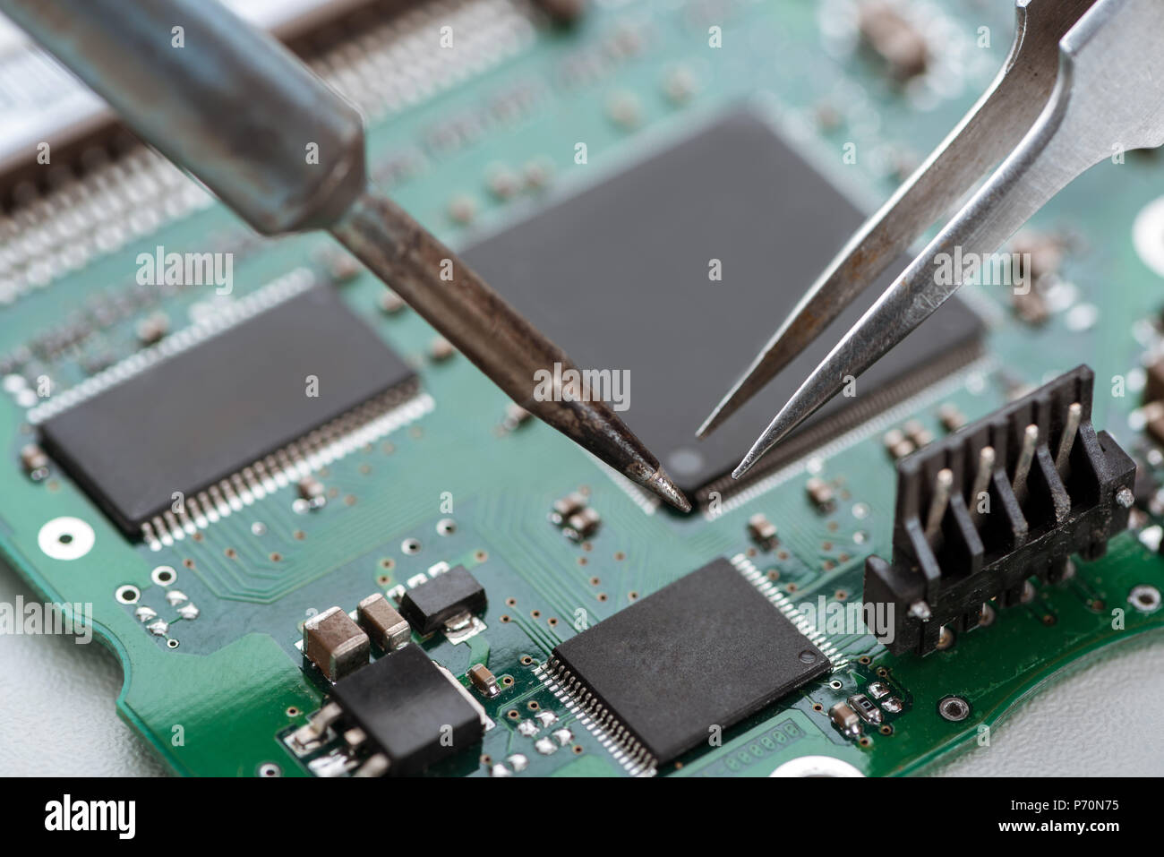 Process of assembling elements on computer motherboard Stock Photo - Alamy