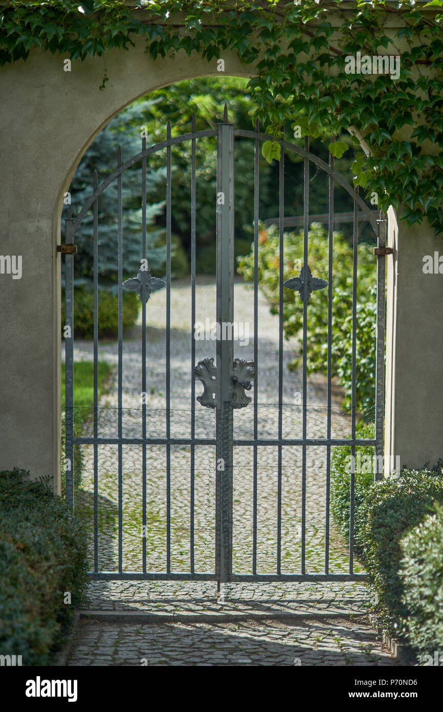 Old Gate overgrown by ivy arch bishop's garden Wroclaw Lower Silesia ...