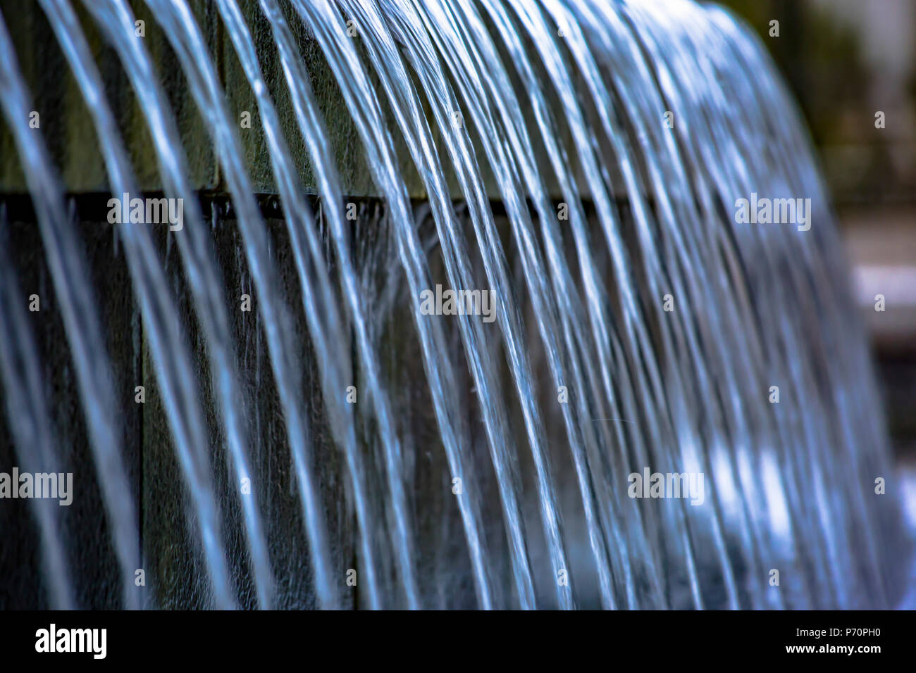 Water fountain with multiple falling streams Stock Photo - Alamy