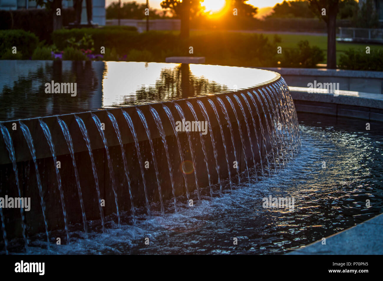 Water fountain with reflections Stock Photo - Alamy