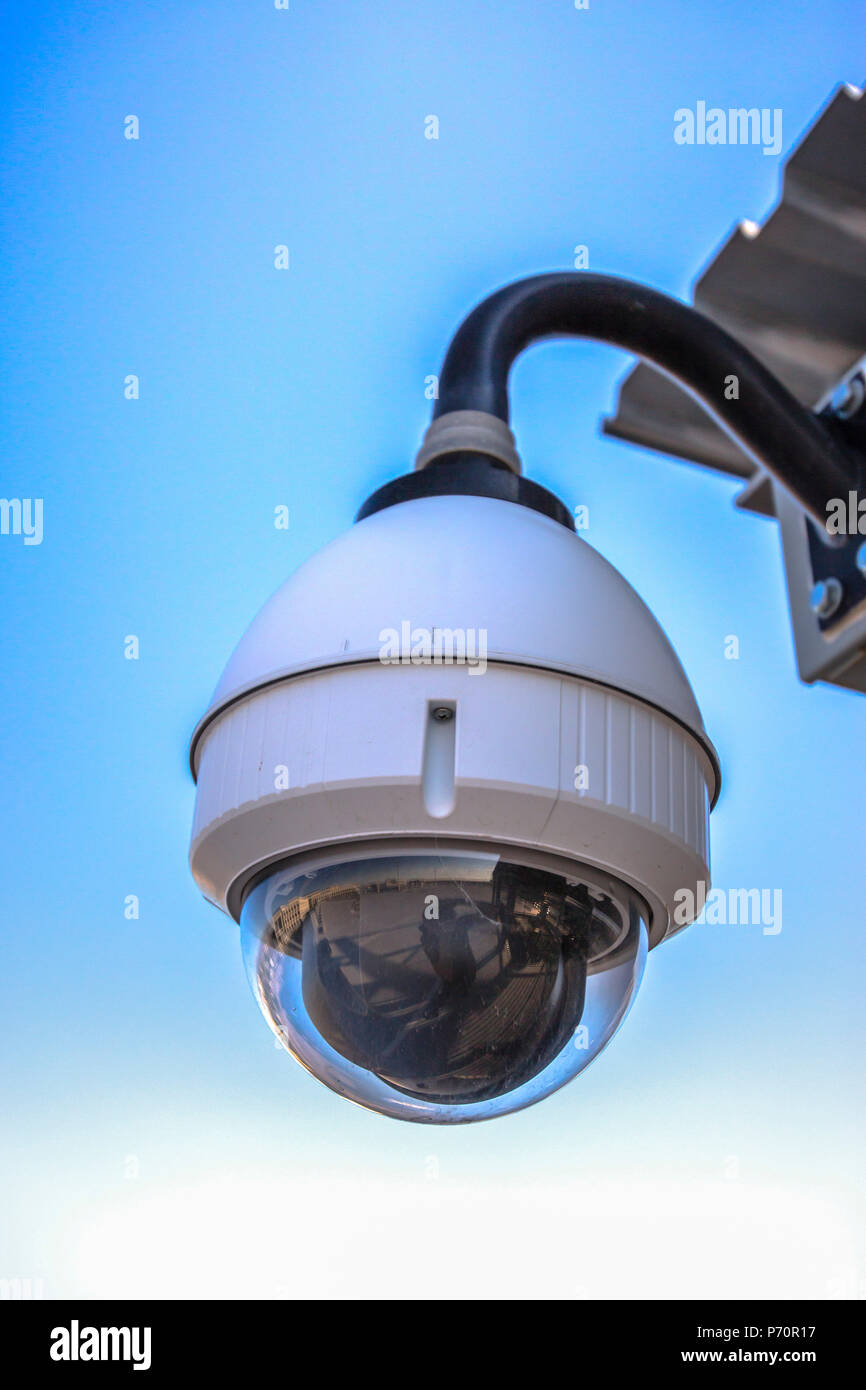 White dome security camera in business districtes Stock Photo - Alamy