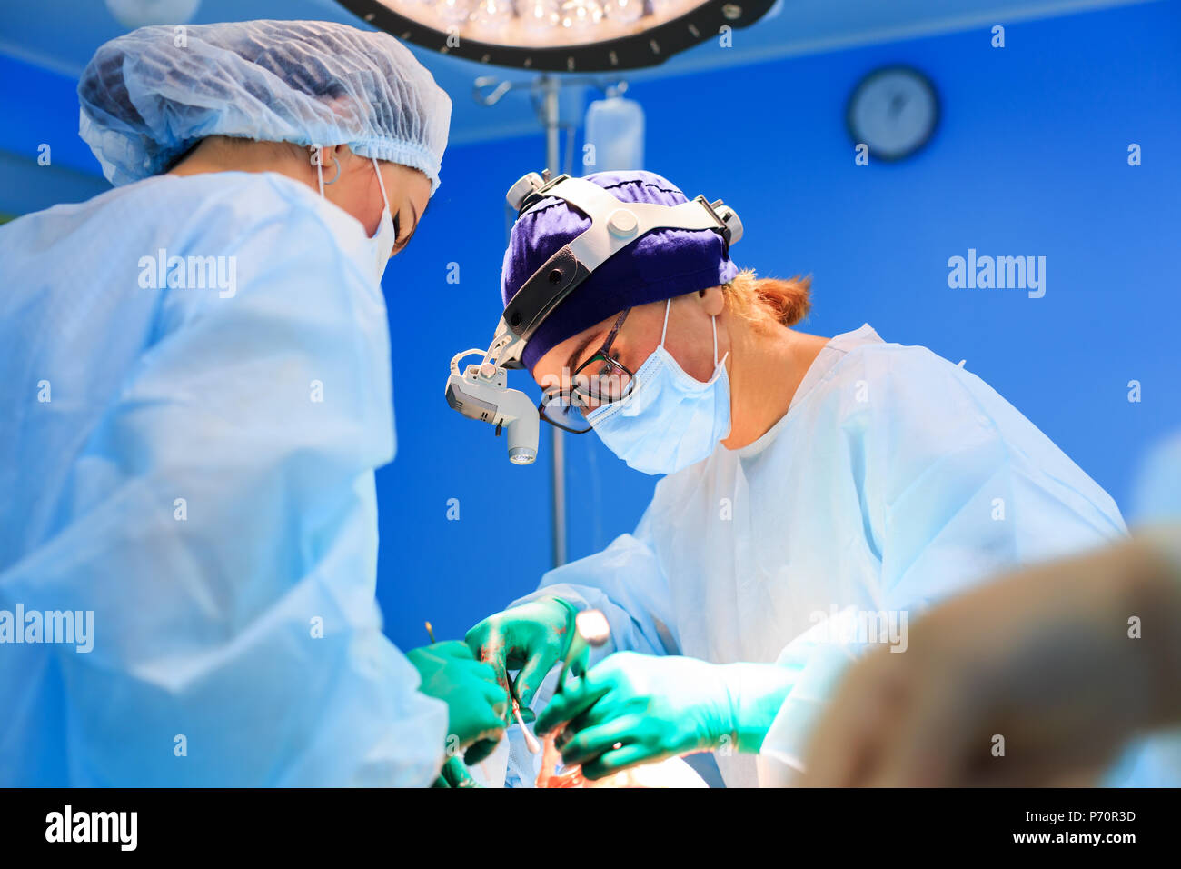 Surgeons operating a patient in operating room Stock Photo - Alamy