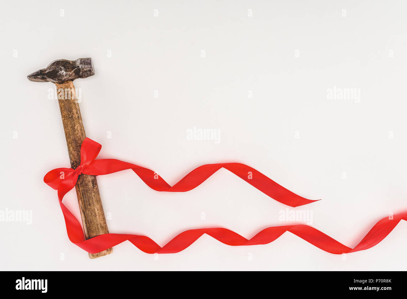 top view of hammer wrapped by red ribbon isolated on white Stock Photo ...