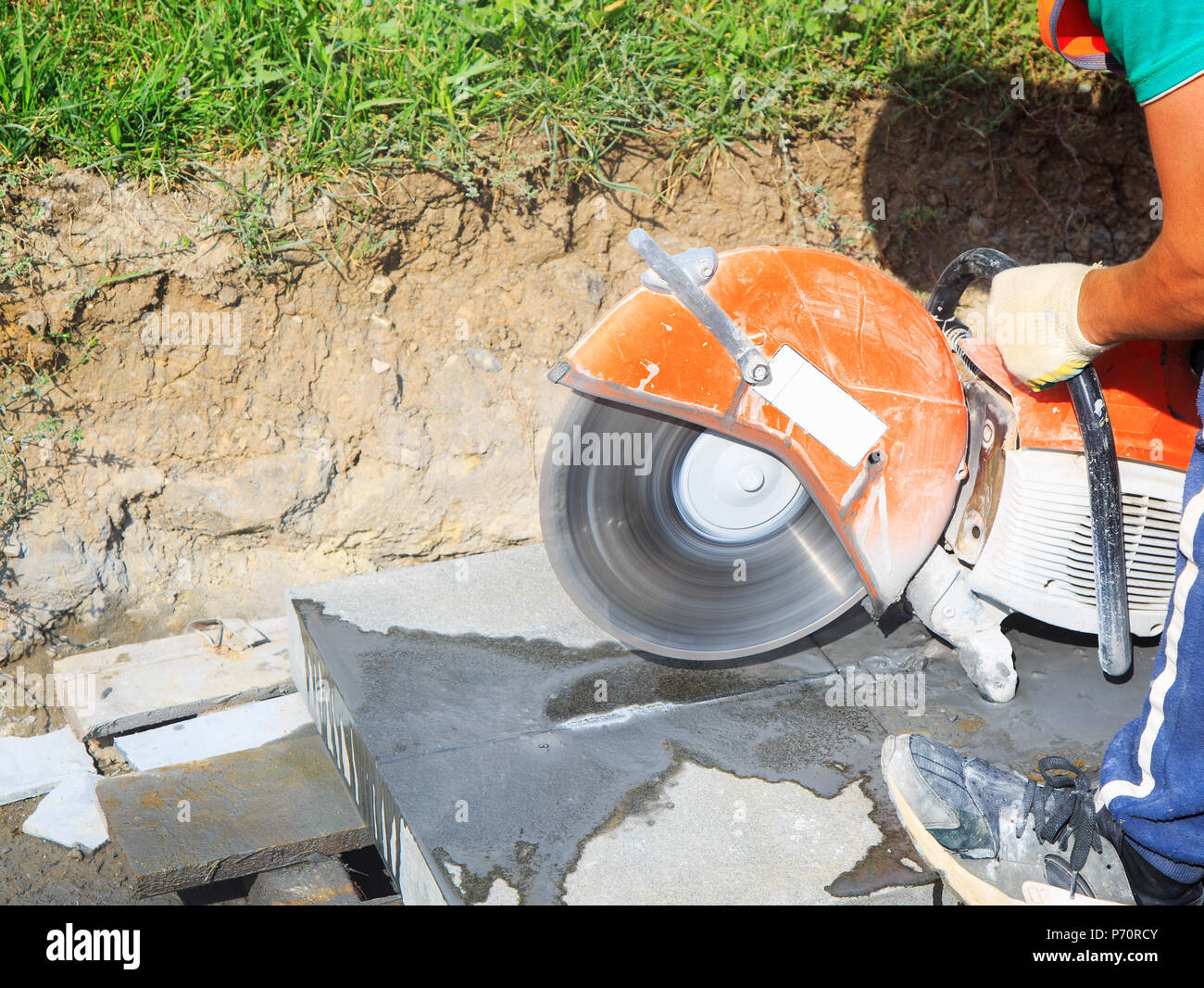 Worker with angle grinder Stock Photo - Alamy