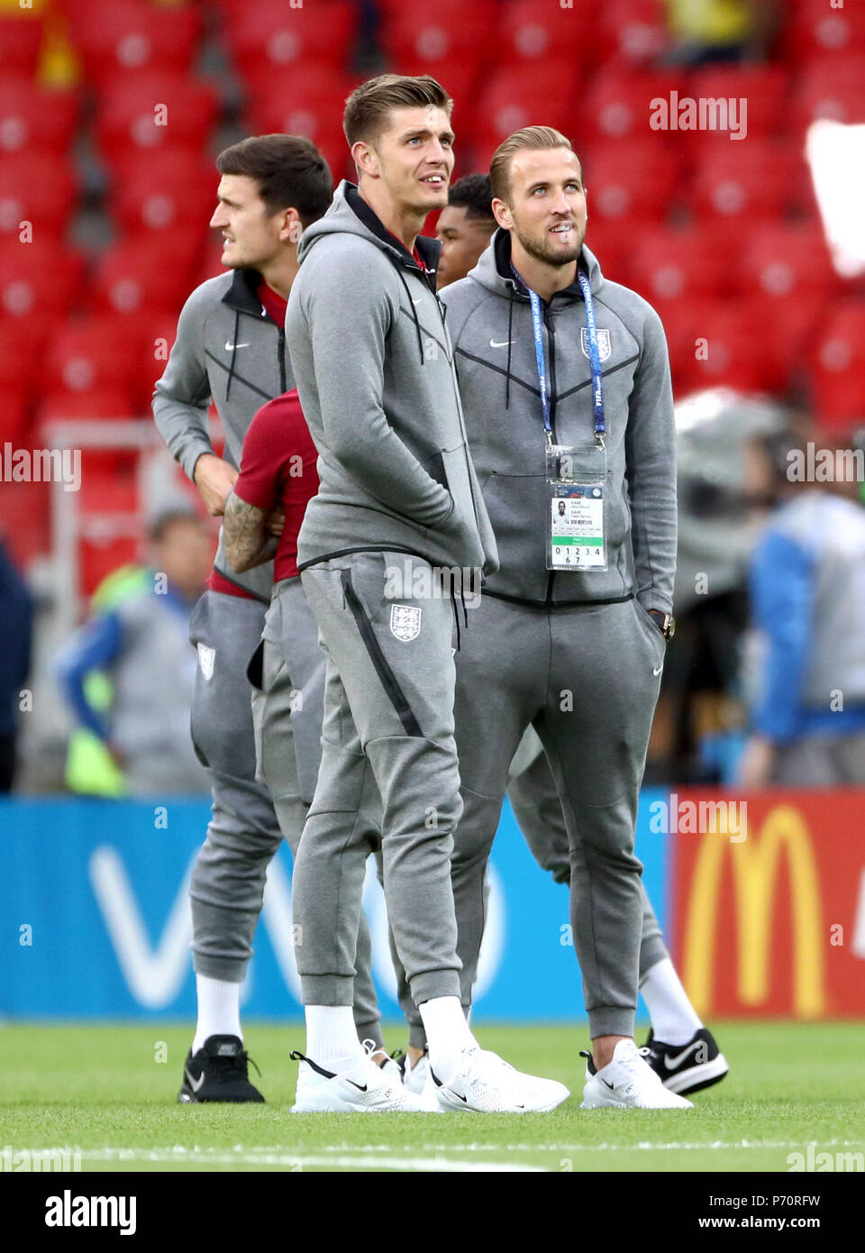 England's Harry Kane (right) and Nick Pope walk the pitch with team ...