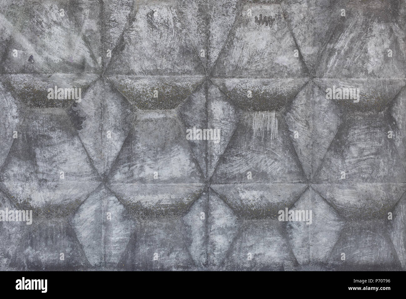 Concrete fence with geometric relief. Grey abstract grunge aged ...