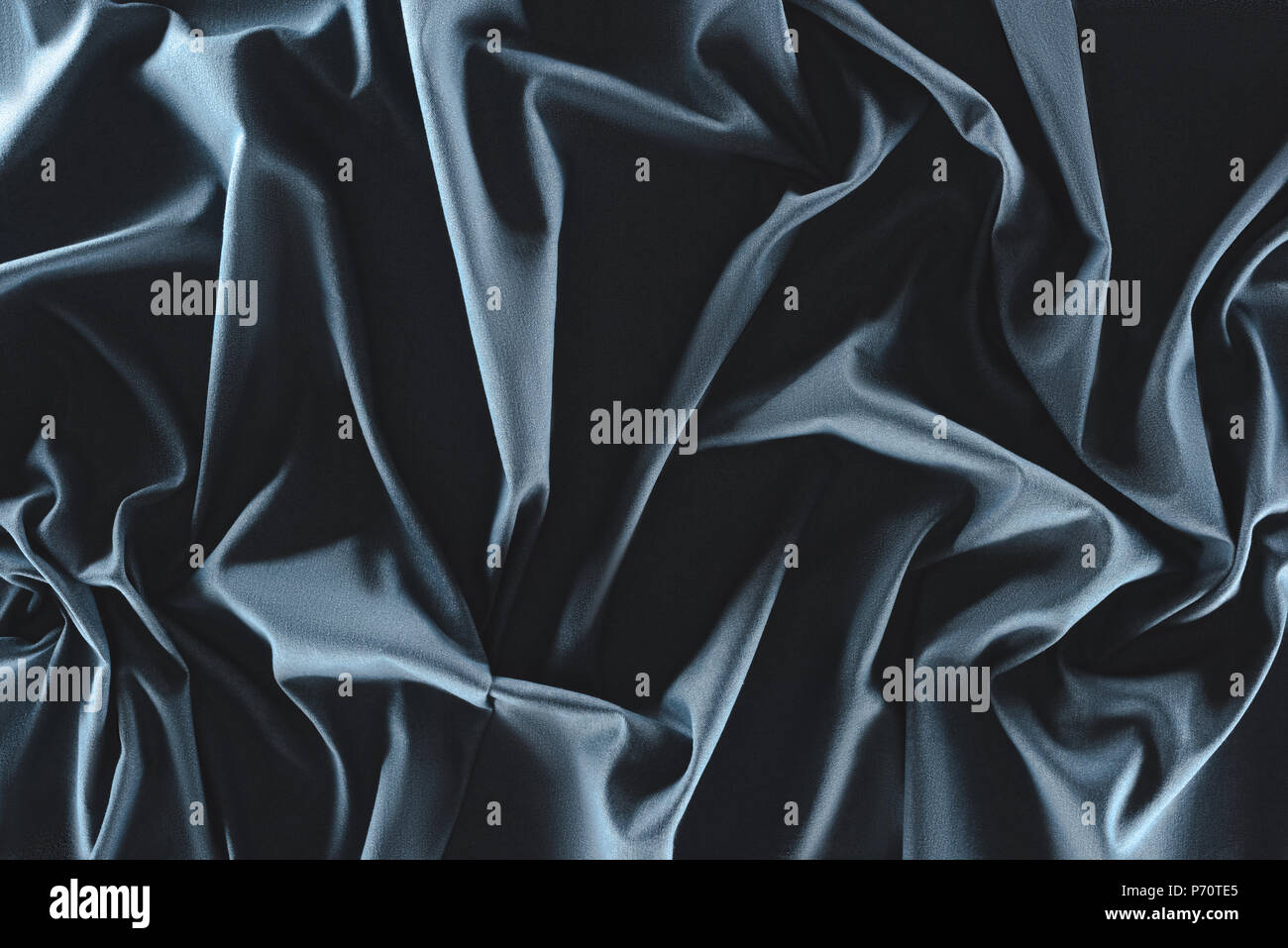close up view of crumpled dark blue silk fabric as background Stock ...