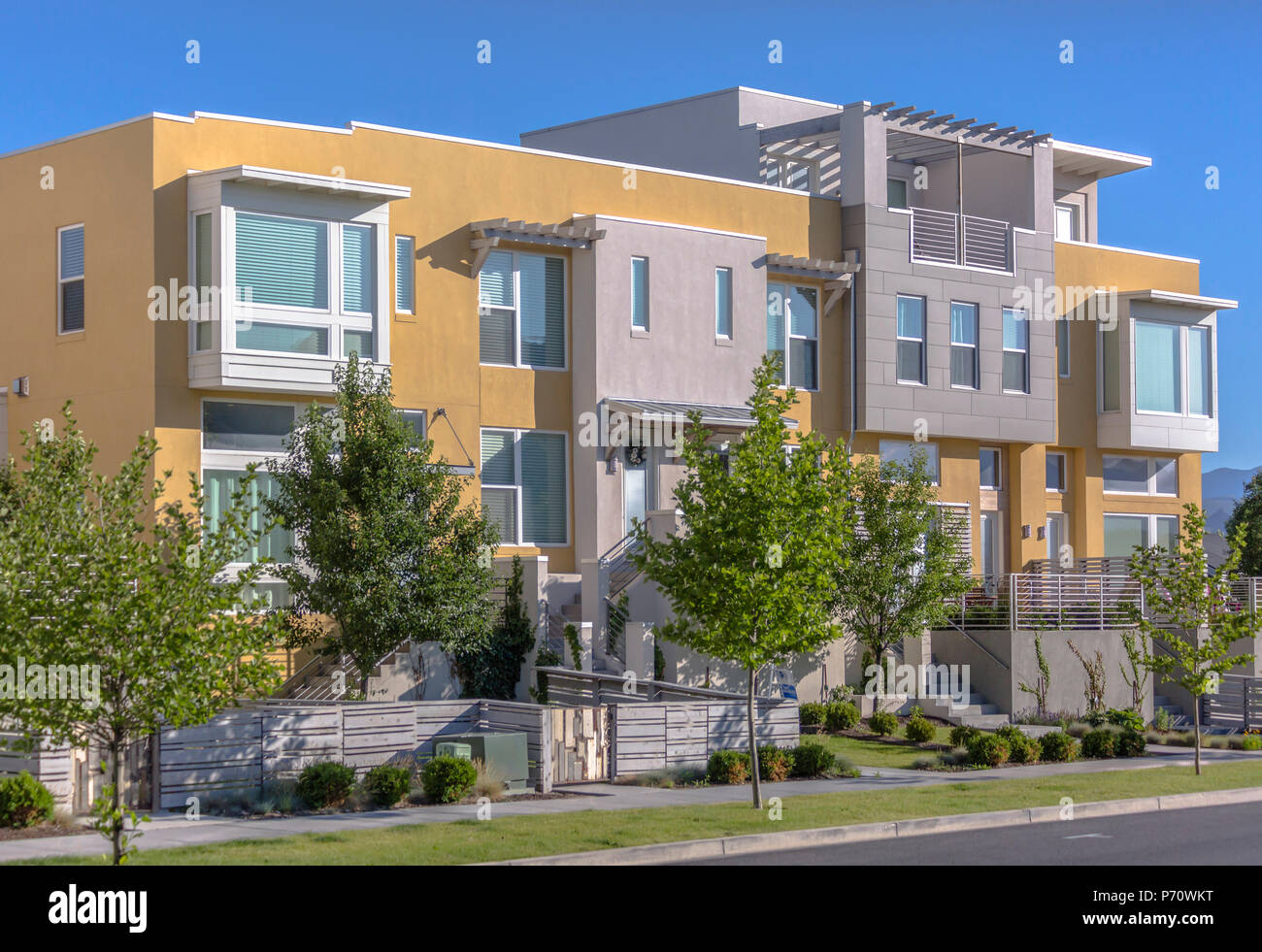 Yellow modern home in Daybreak Stock Photo - Alamy