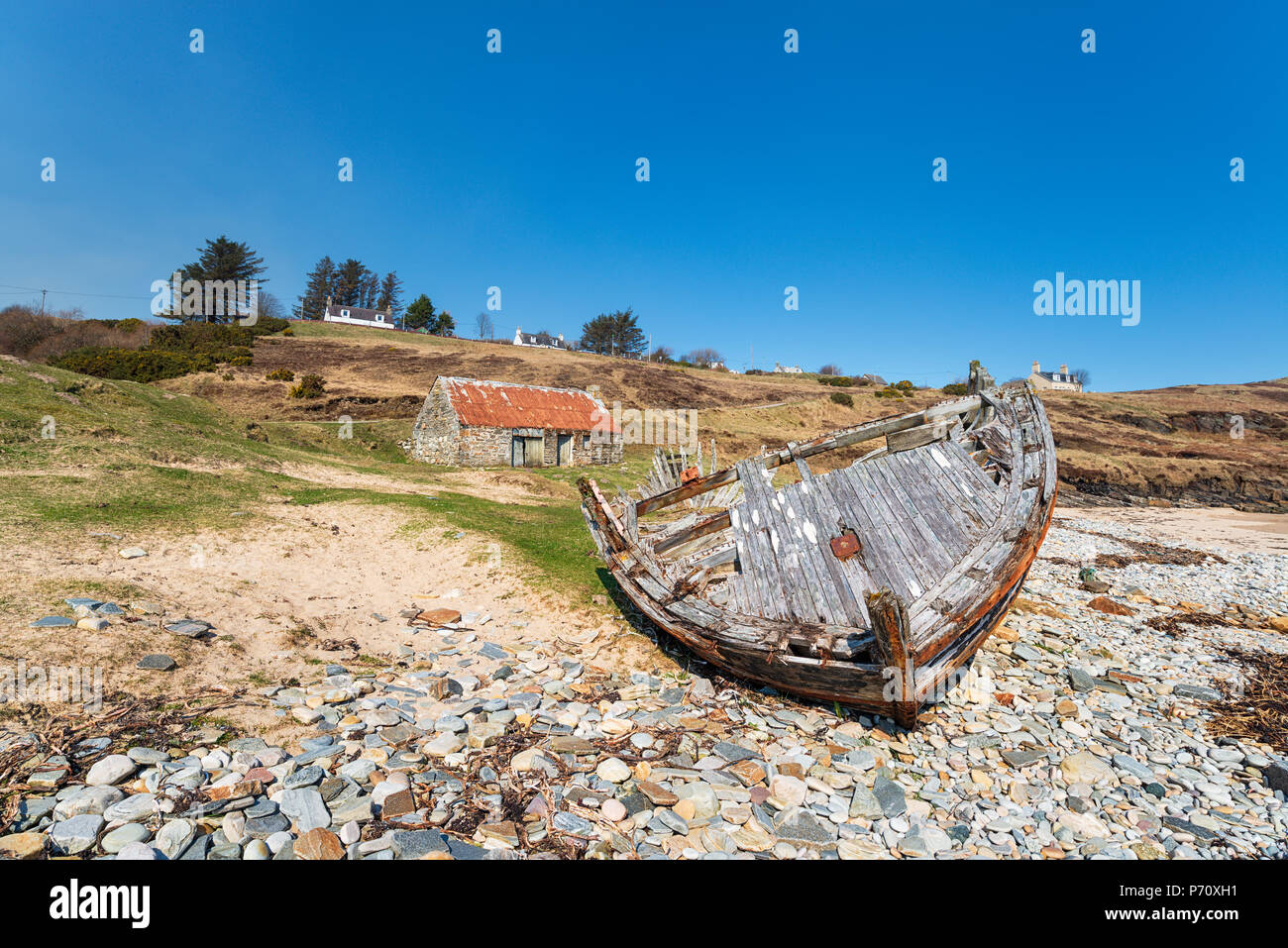 An old boat hull on the beach at Talmine Bay on the north coast of ...