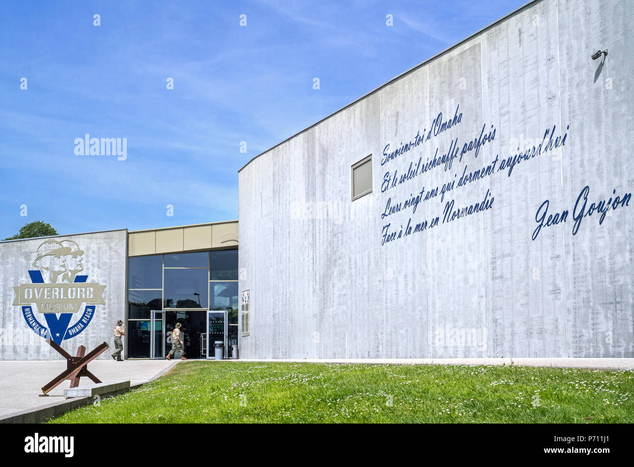 Tourists at entrance of Overlord Museum near Omaha Beach about WW2 ...