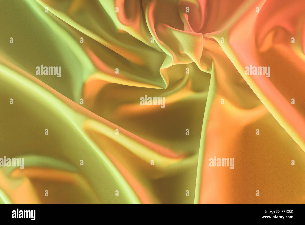 toned picture of folded silk cloth background Stock Photo - Alamy