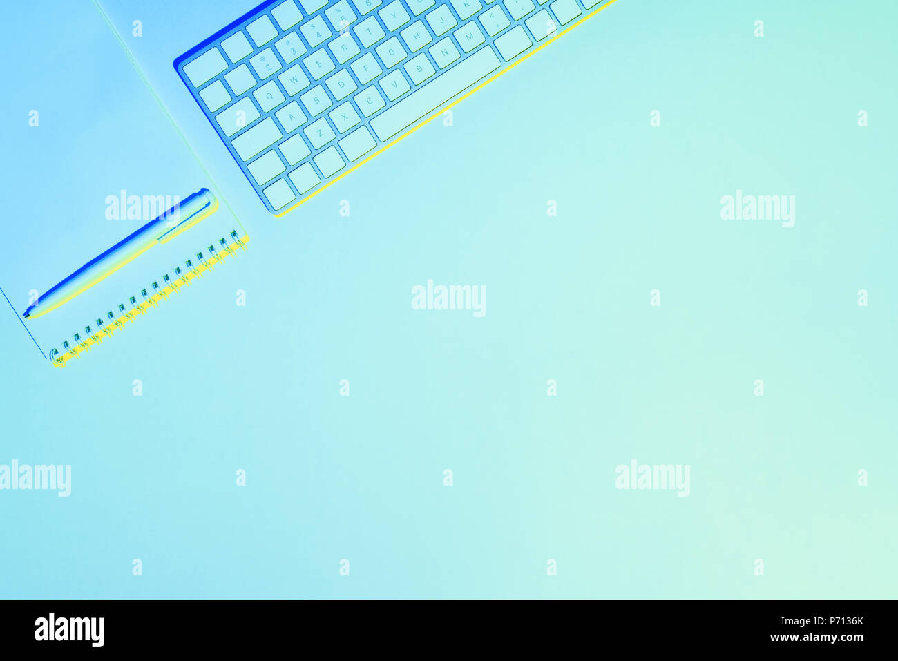 blue toned picture of computer keyboard, empty textbook and pen Stock ...