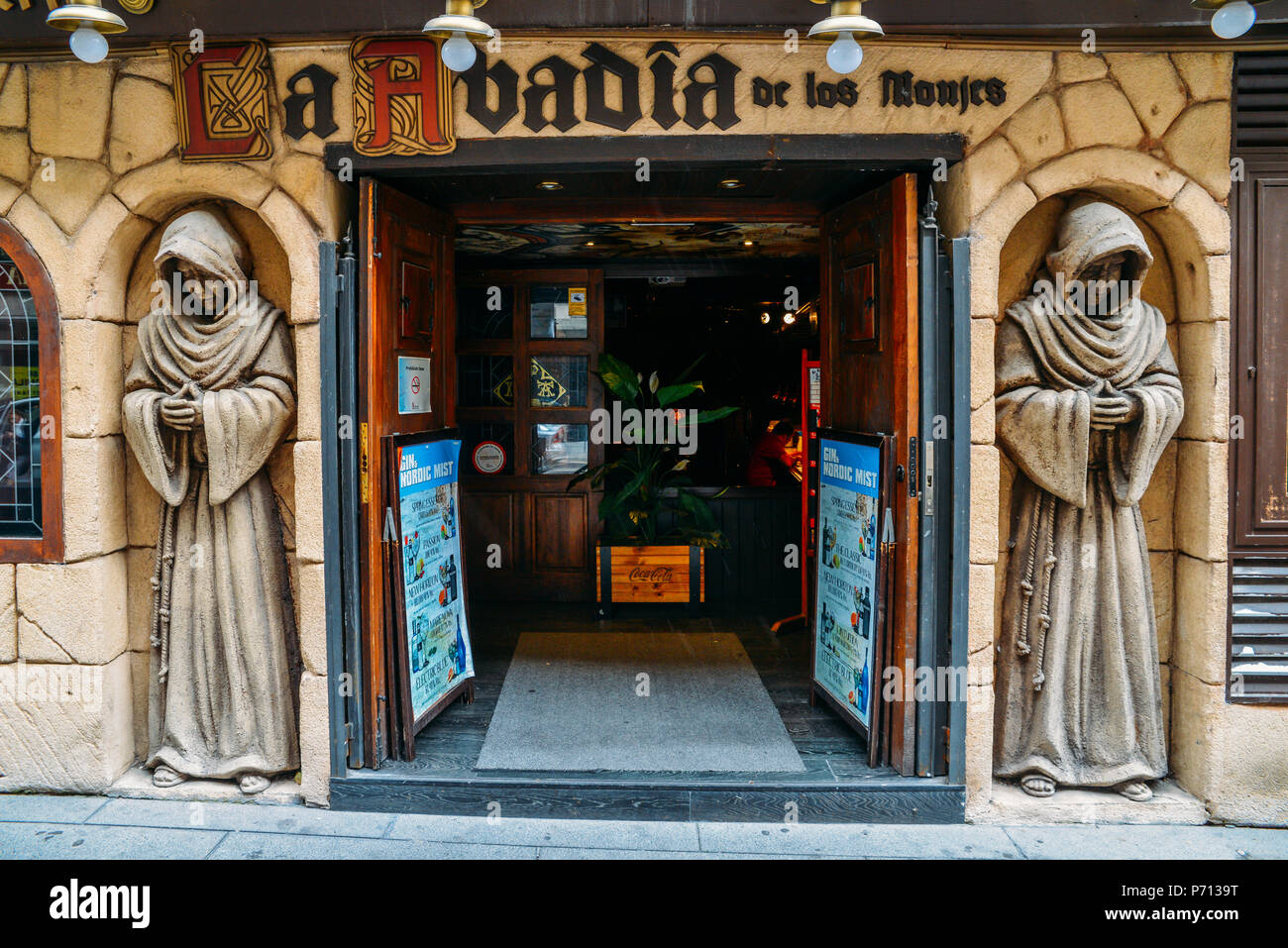 Salamanca, Spain - June 12, 2018: Entrance to a monastery-themed bar in ...
