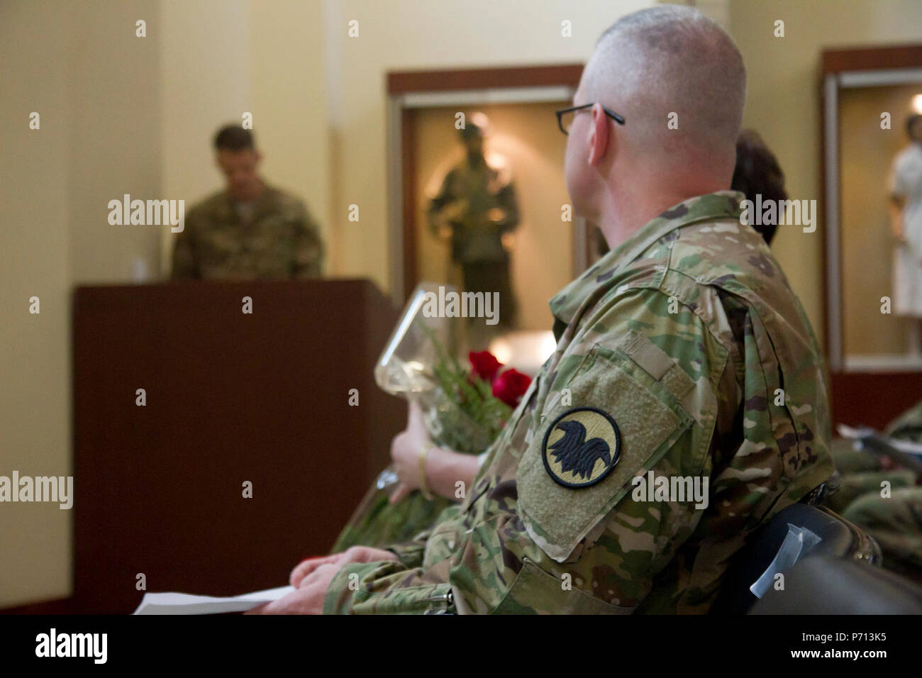 Maj. Jeffrey Engle listens to remarks by Lt. Col. Brian Hoffman, the ...