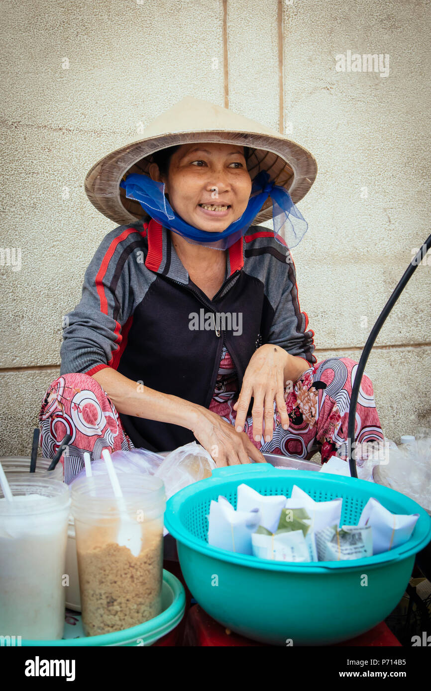 Vietnamese woman cooking on the street, Ho Chi Minh City, Vietnam ...