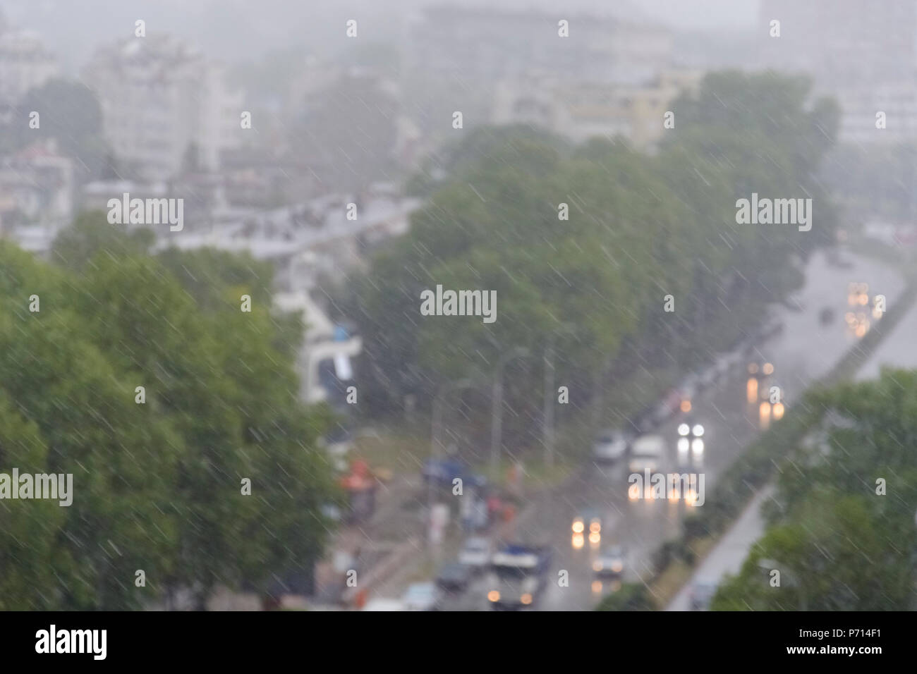 Heavy rain ,vertical drops against trees in the background Stock Photo ...