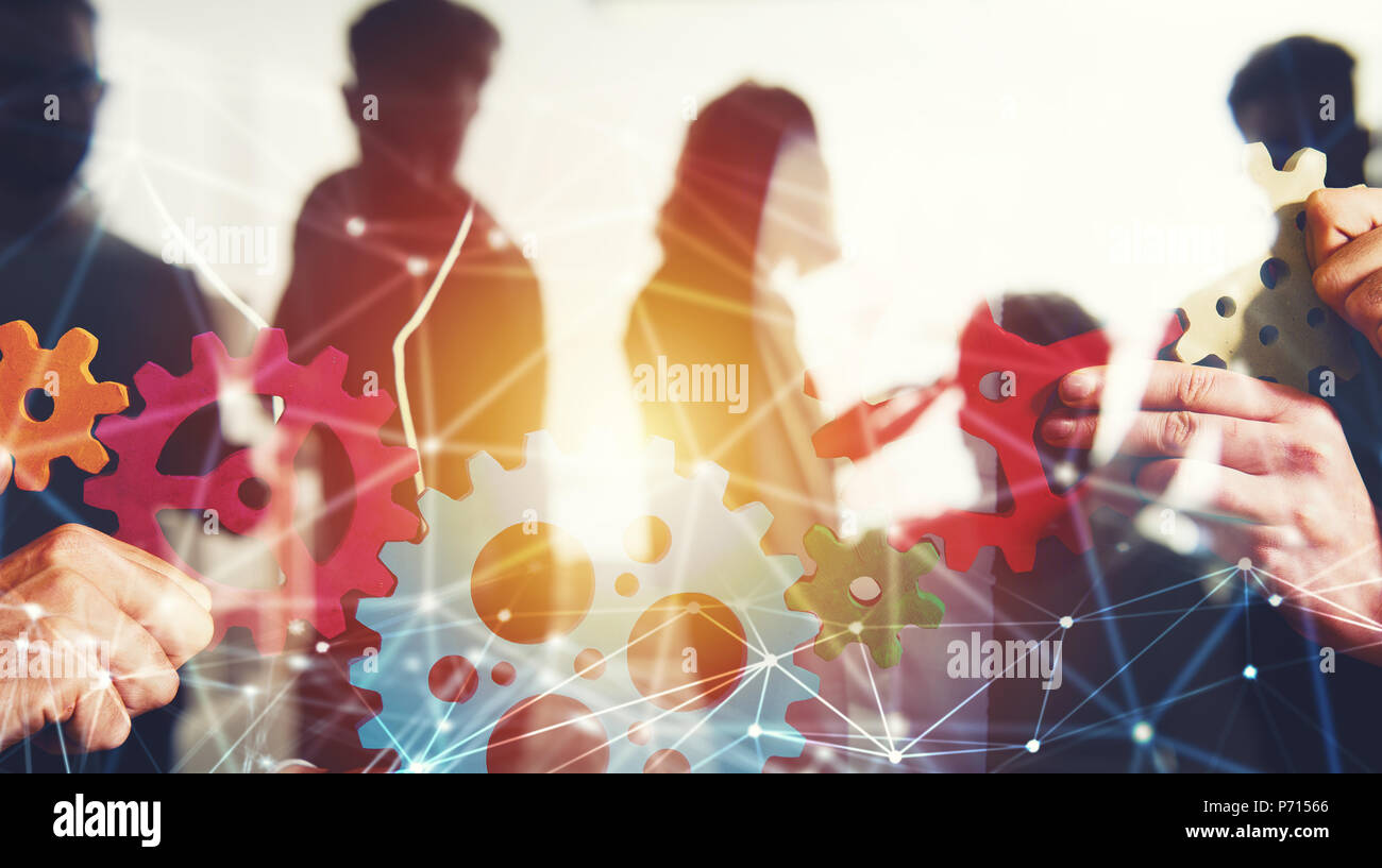 Business team connect pieces of gears. Teamwork, partnership and ...