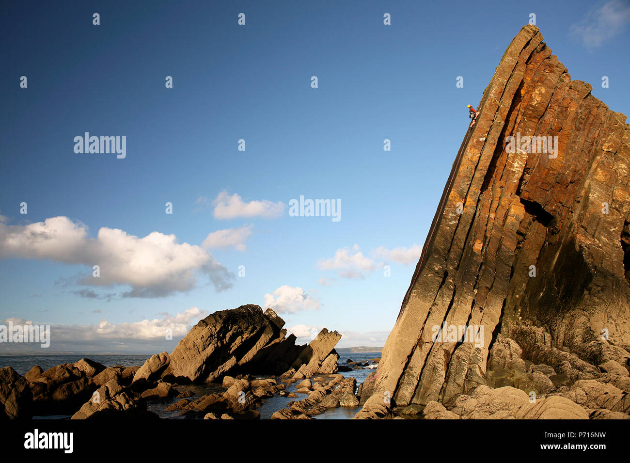 Rock climber in action, Culm Coast, North Devon, England, United ...
