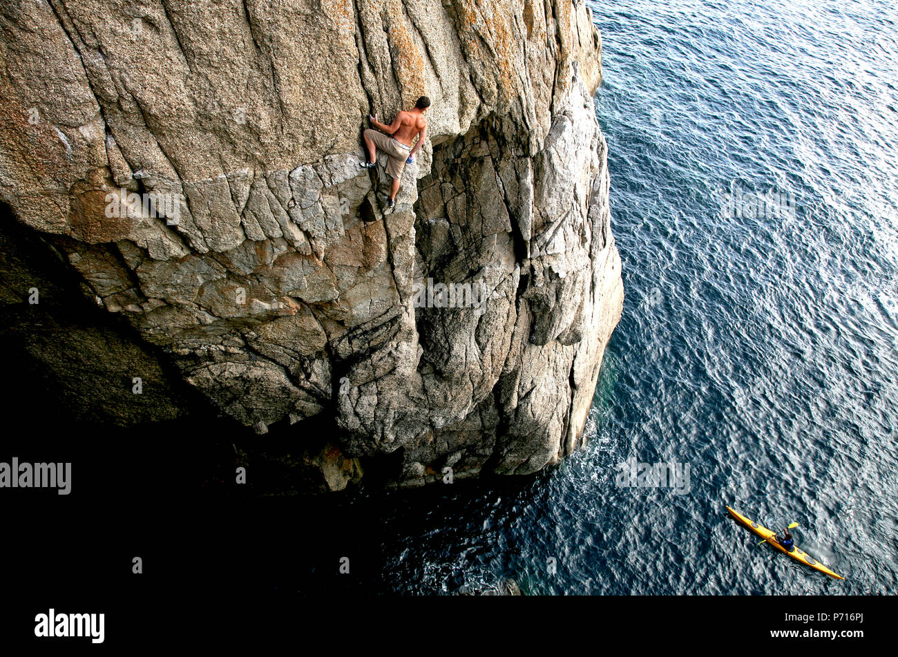 Rock climber in action, Lundy Island, North Devon, England, United ...