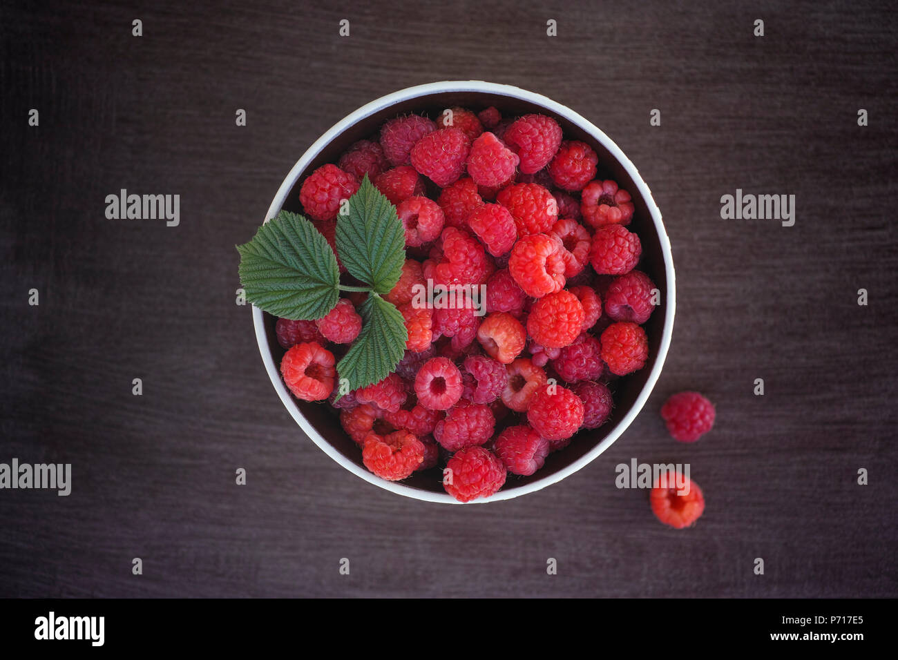 Fresh raspberry in bowl hi-res stock photography and images - Alamy