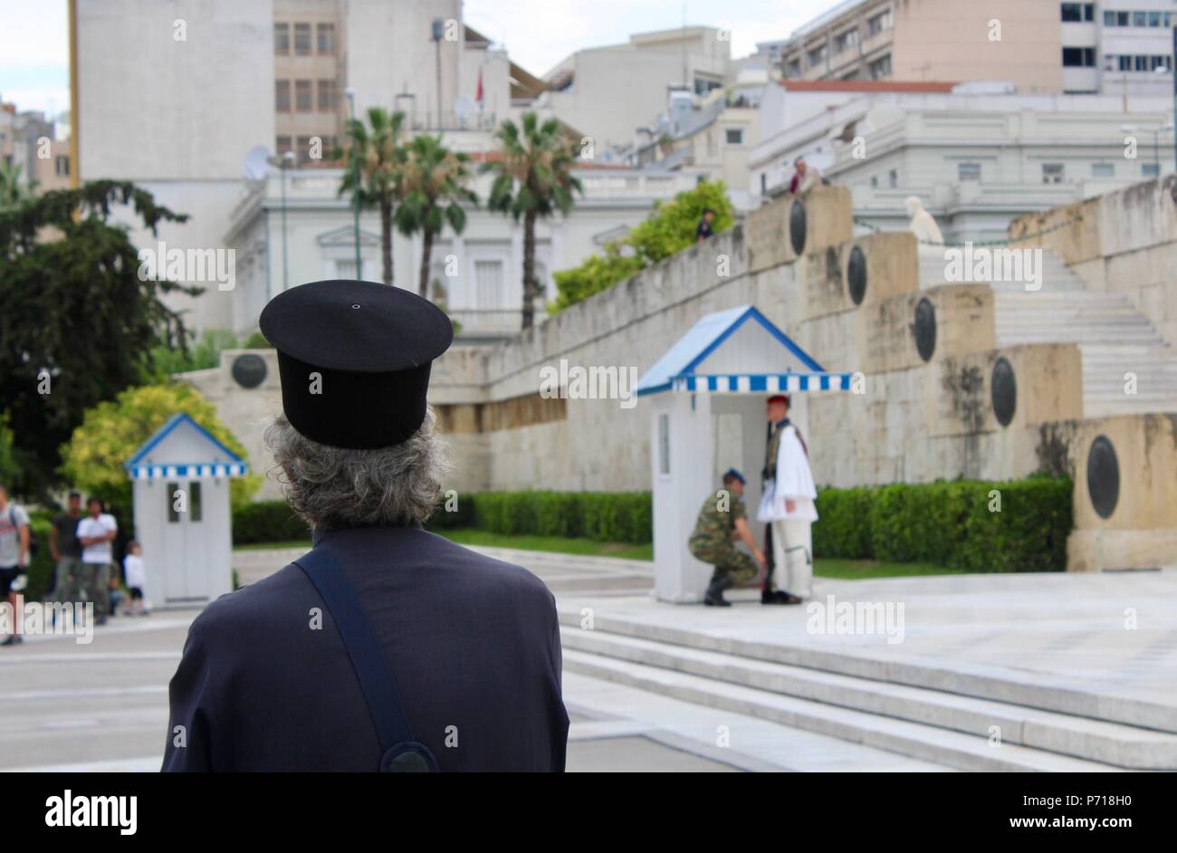 orthodox priest watching ceremonial change of guards outside the greek ...
