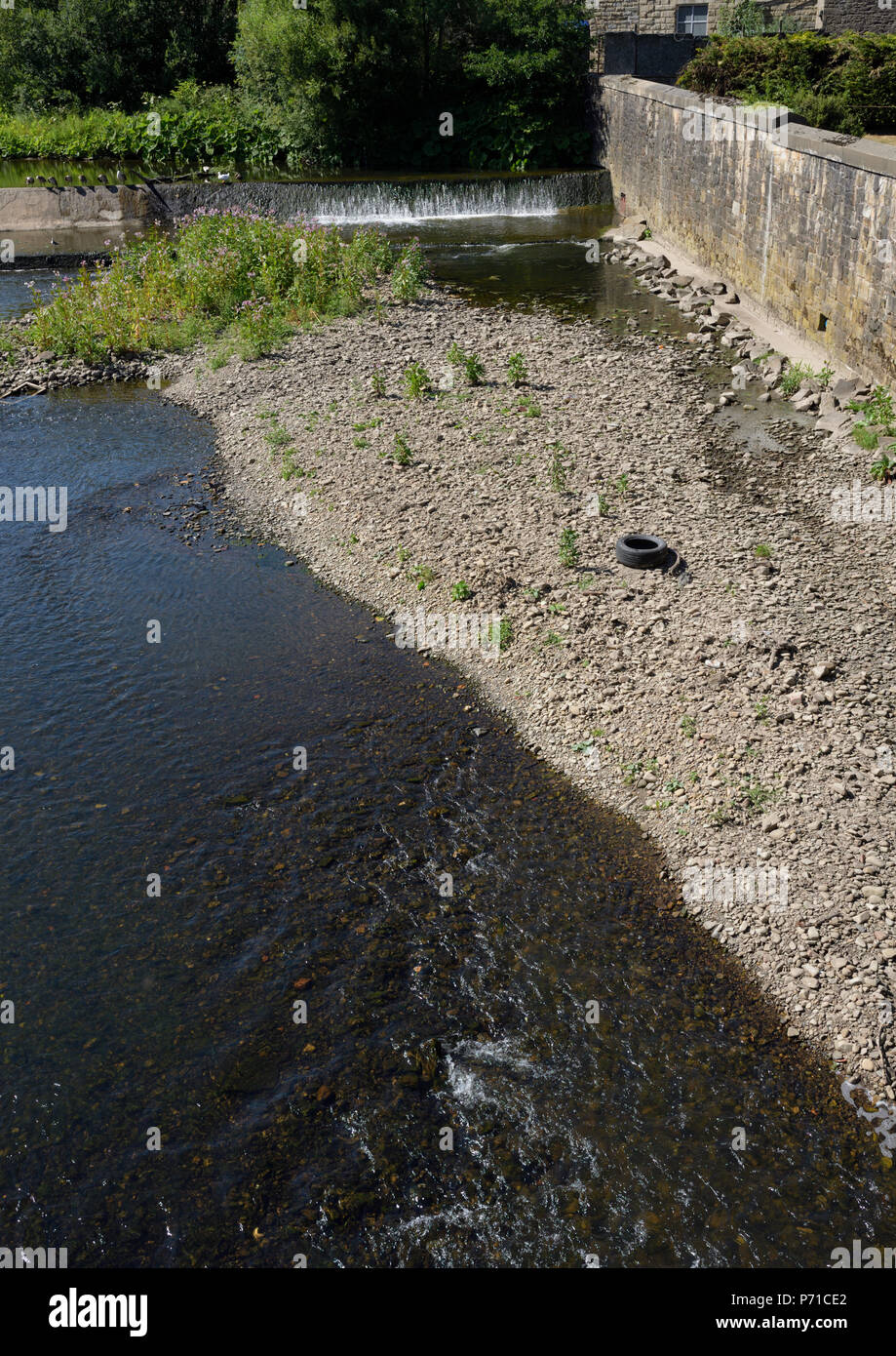 River irwell with sediment deposited against wall in ramsbottom bury ...