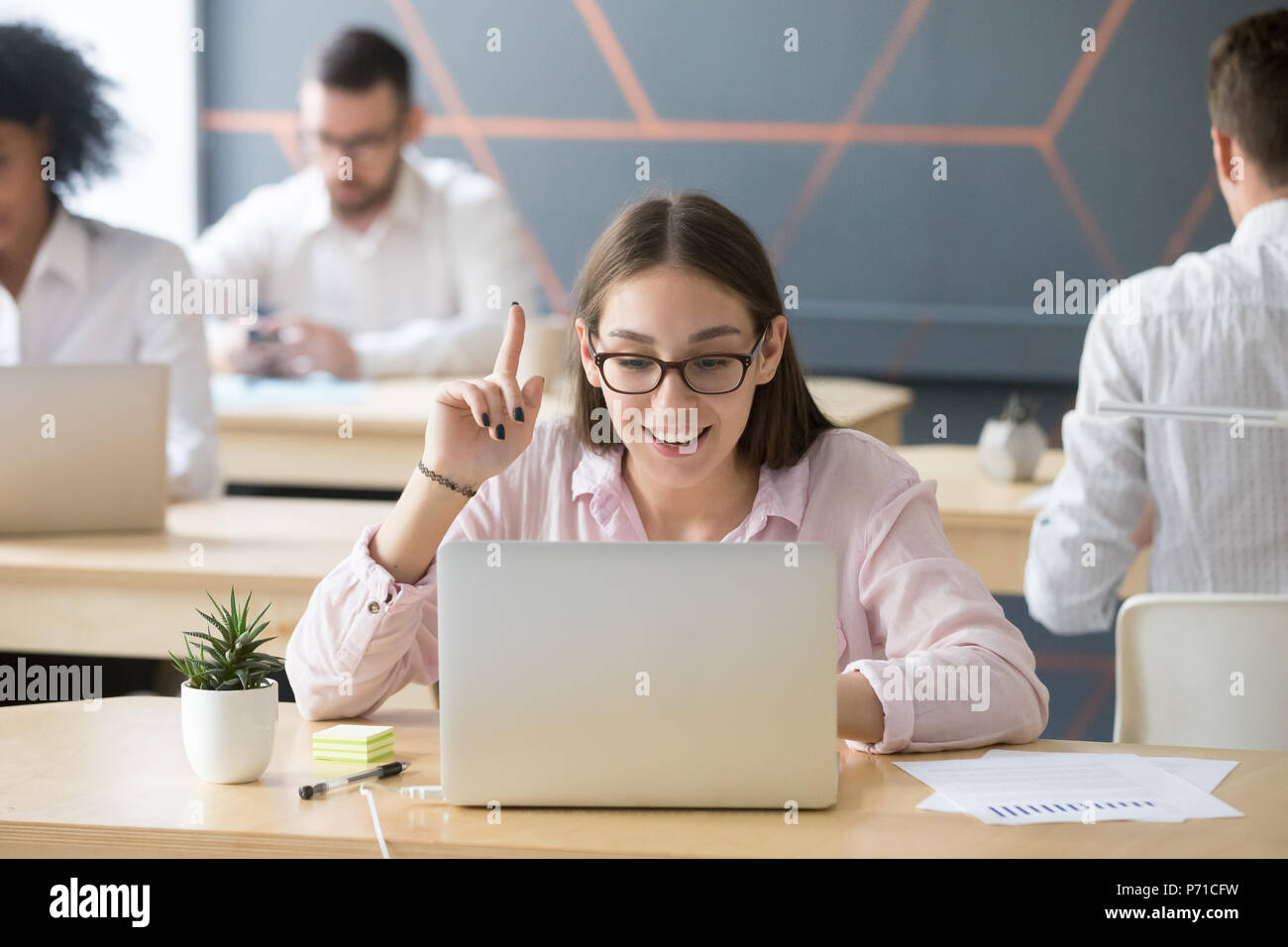 Intelligent employee reaching great idea working at laptop on of Stock ...