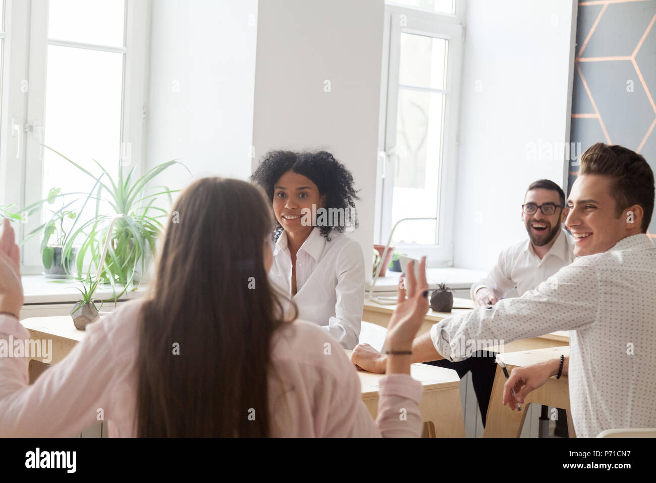 Excited employees shocked by coworker online lottery win Stock Photo ...