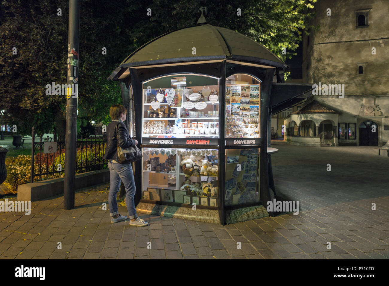 KOSICE, SLOVAKIA - OCTOBER 02, 2017: Woman stands in front of kiosk ...