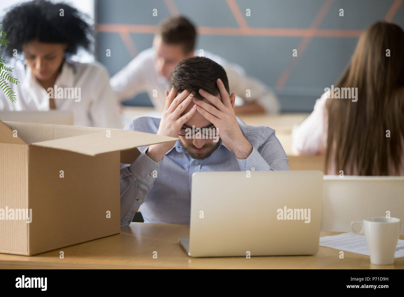 Upset male employee stressed being fired from work Stock Photo - Alamy