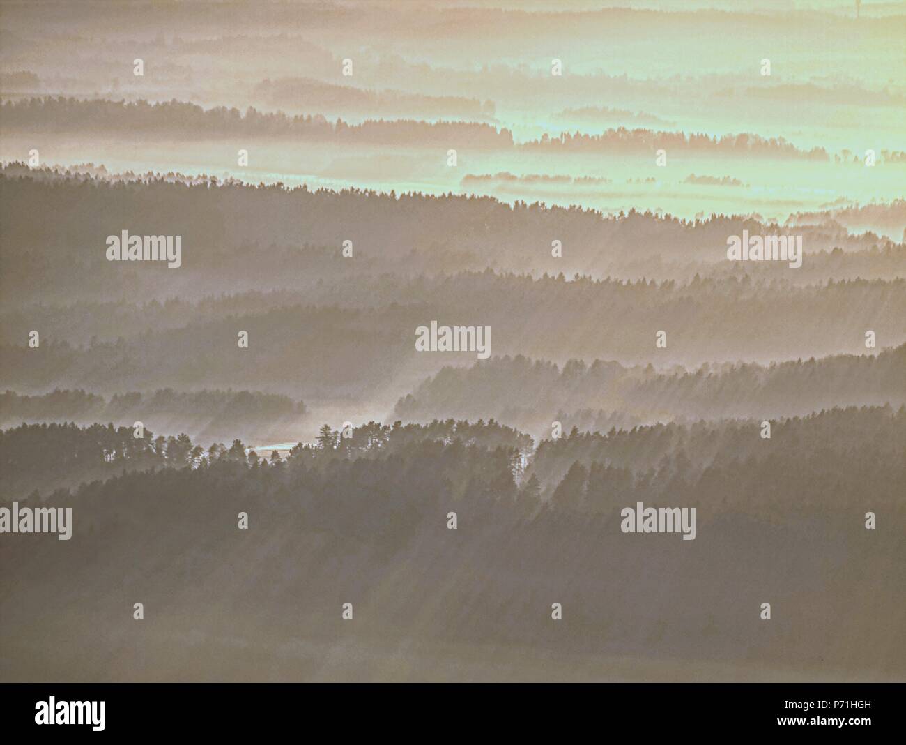 Golden mist above rounded hills in Landscape. Outline of real landscape ...