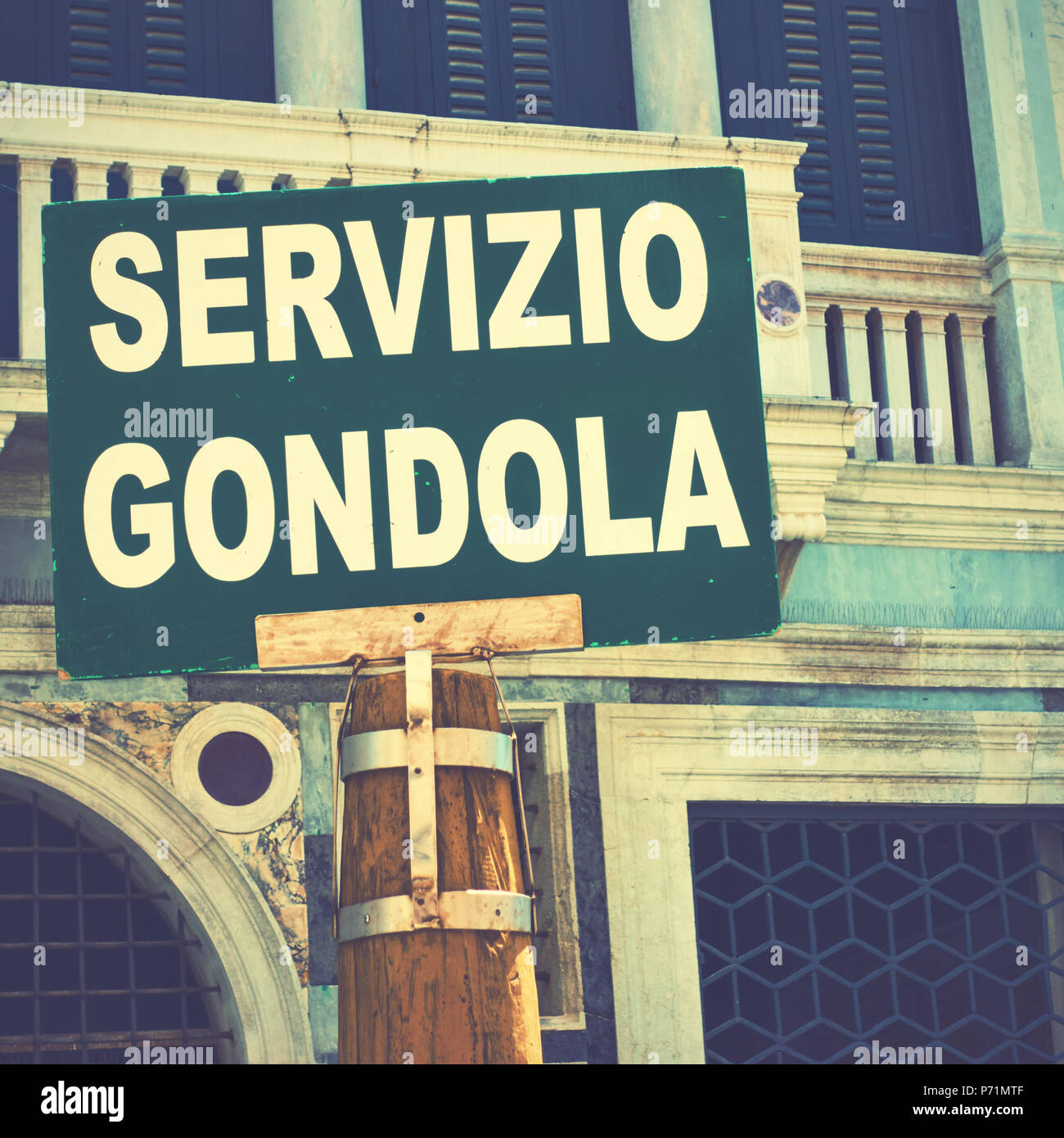 Gondola service sign on a pole in Venice, Italy/ Vintage style image ...