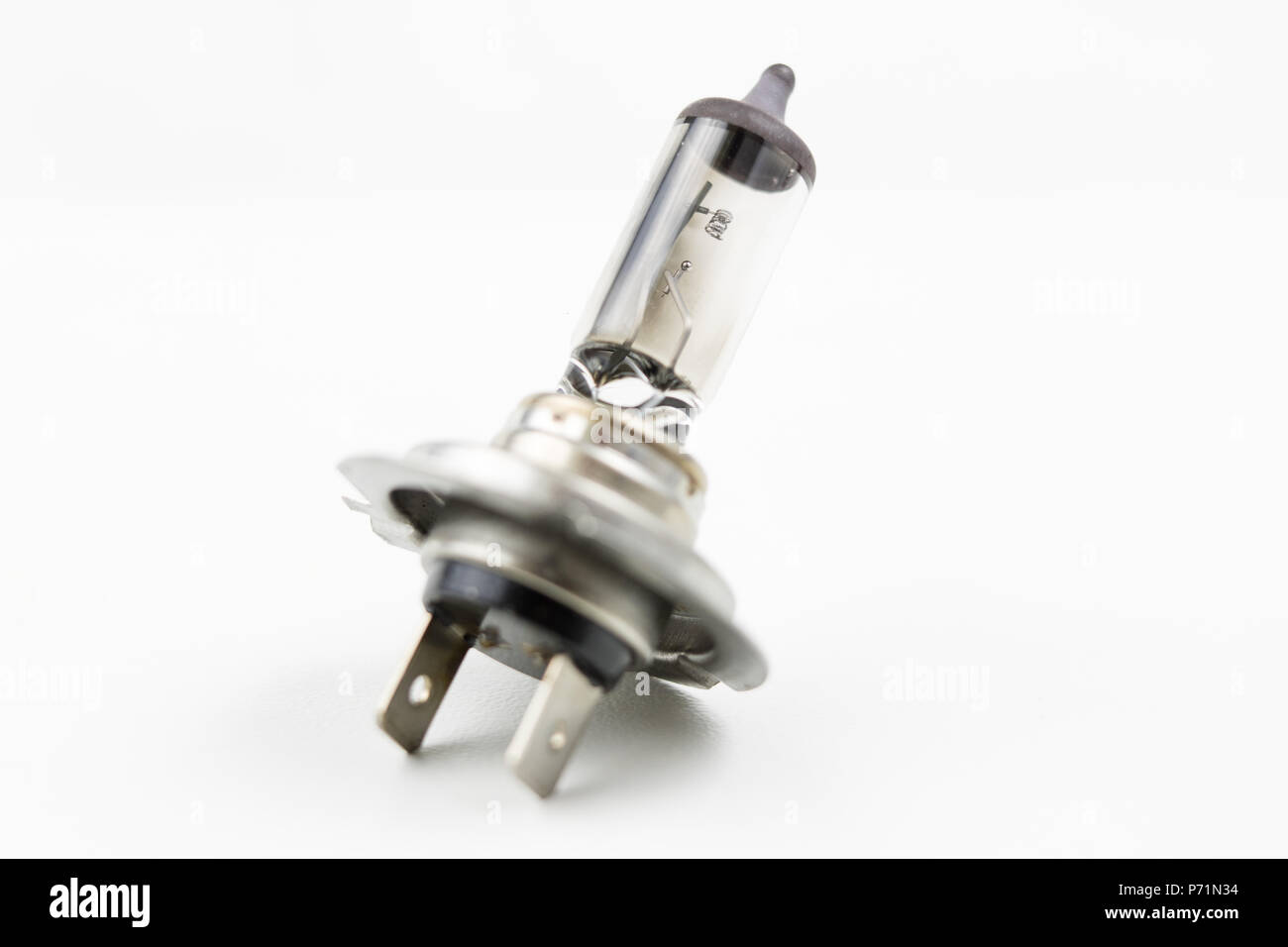 Car bulb on a white workshop table. Electric car accessories. White ...