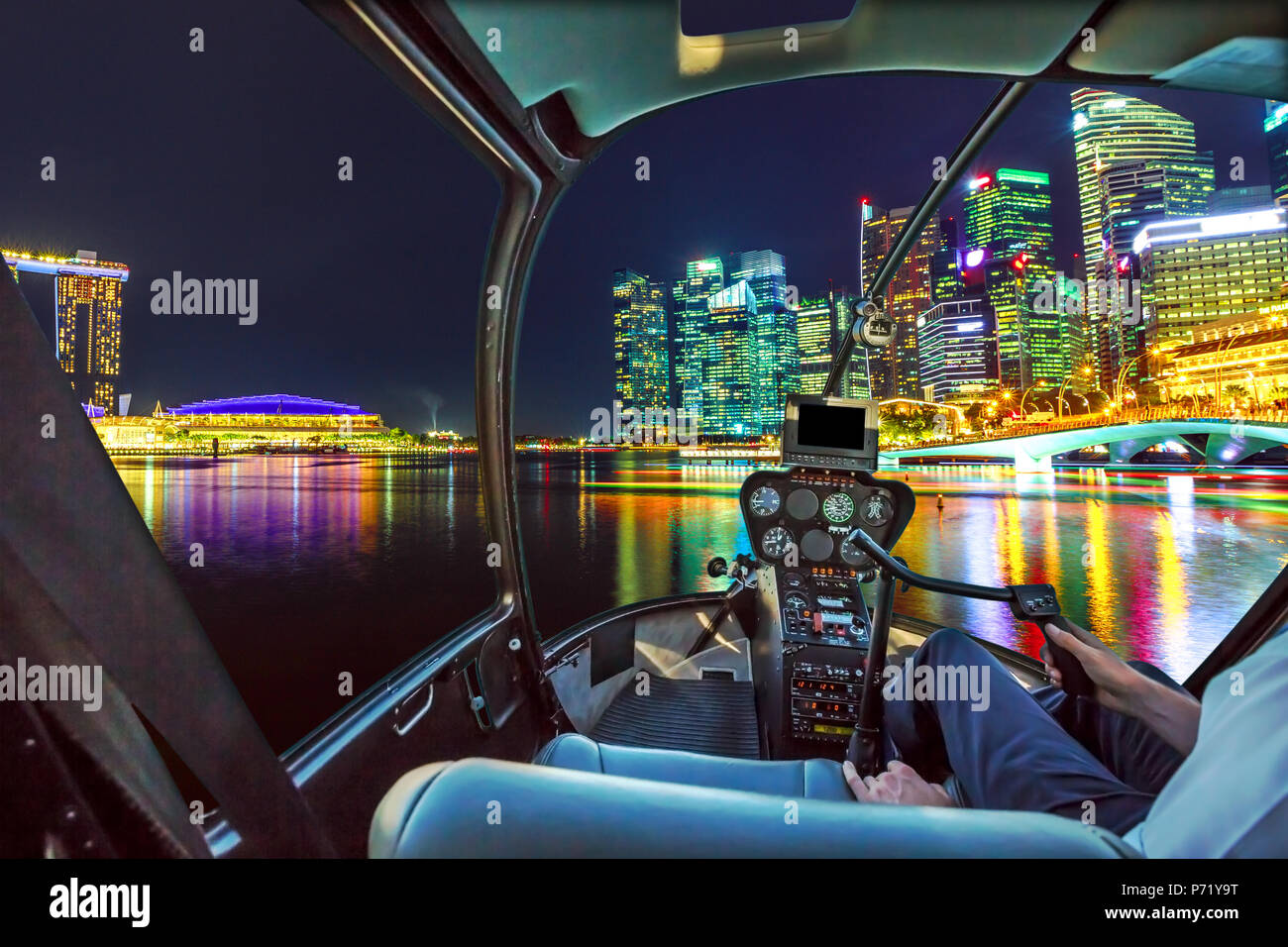 Helicopter cabin interior flying on Panorama of Singapore buildings and ...