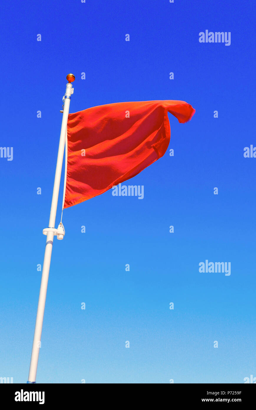 Red danger flag flying hi-res stock photography and images - Alamy