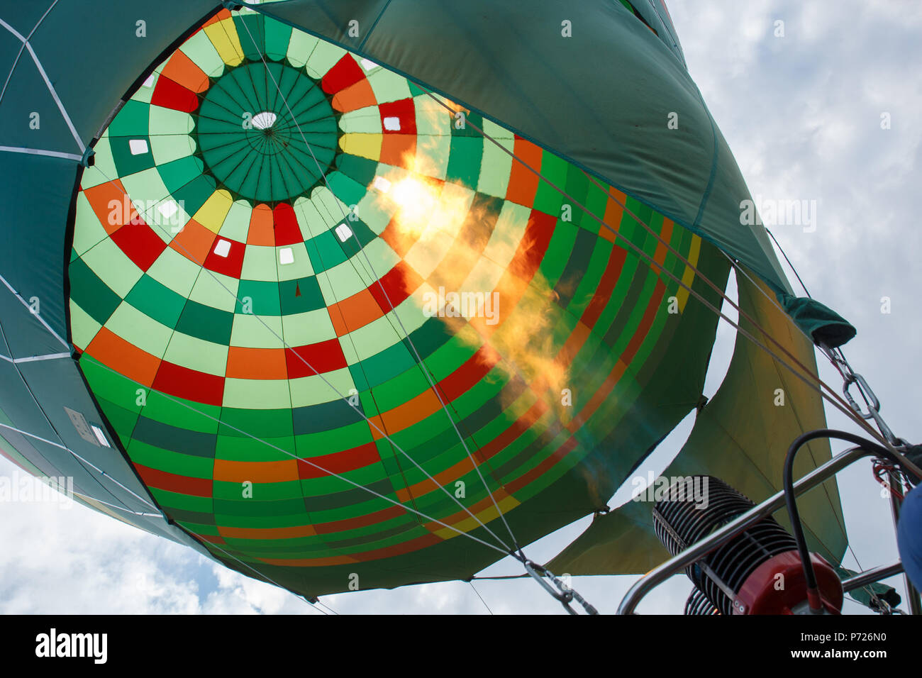 hot air balloon preparing for flight, heating air with fire Stock Photo ...