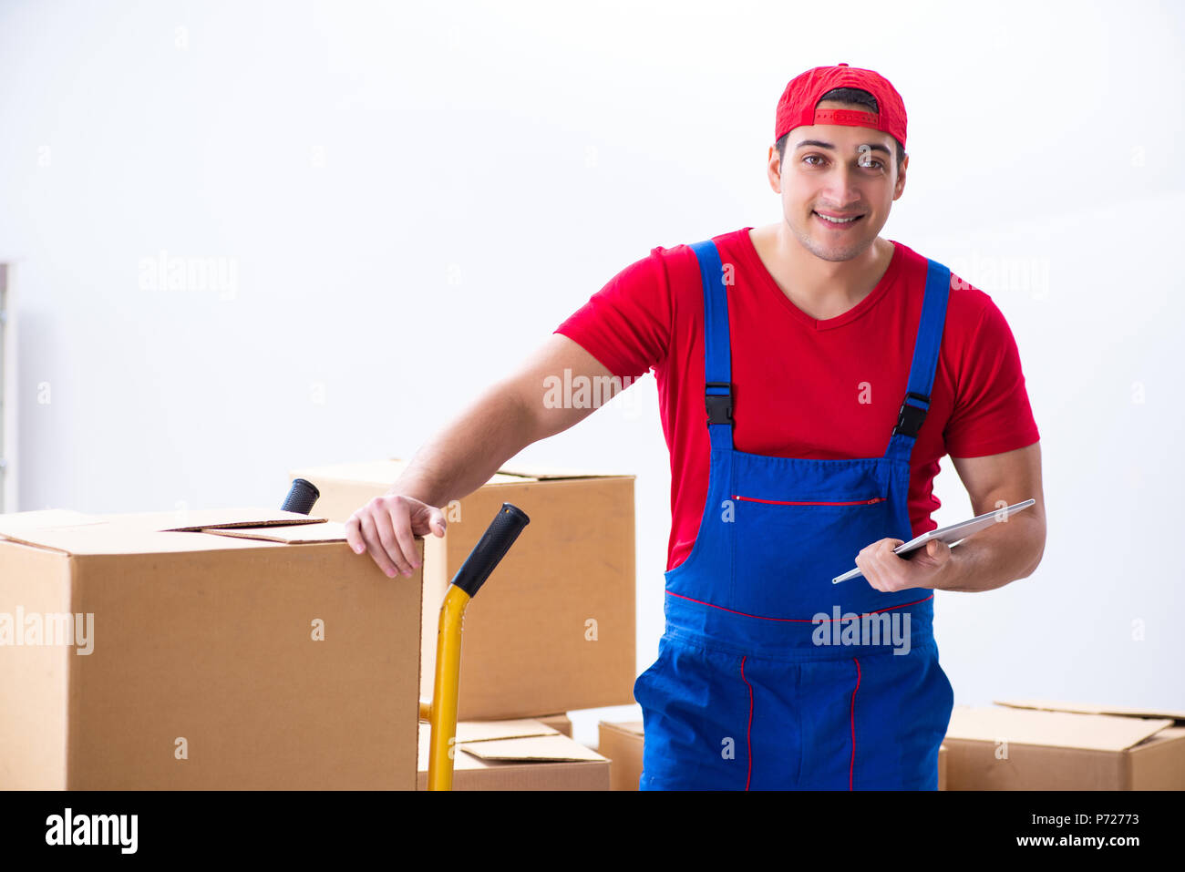 Contractor worker moving boxes during office move Stock Photo - Alamy