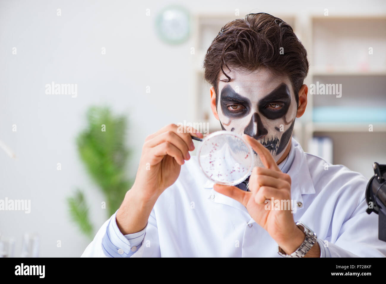 Scary monster doctor working in lab Stock Photo - Alamy